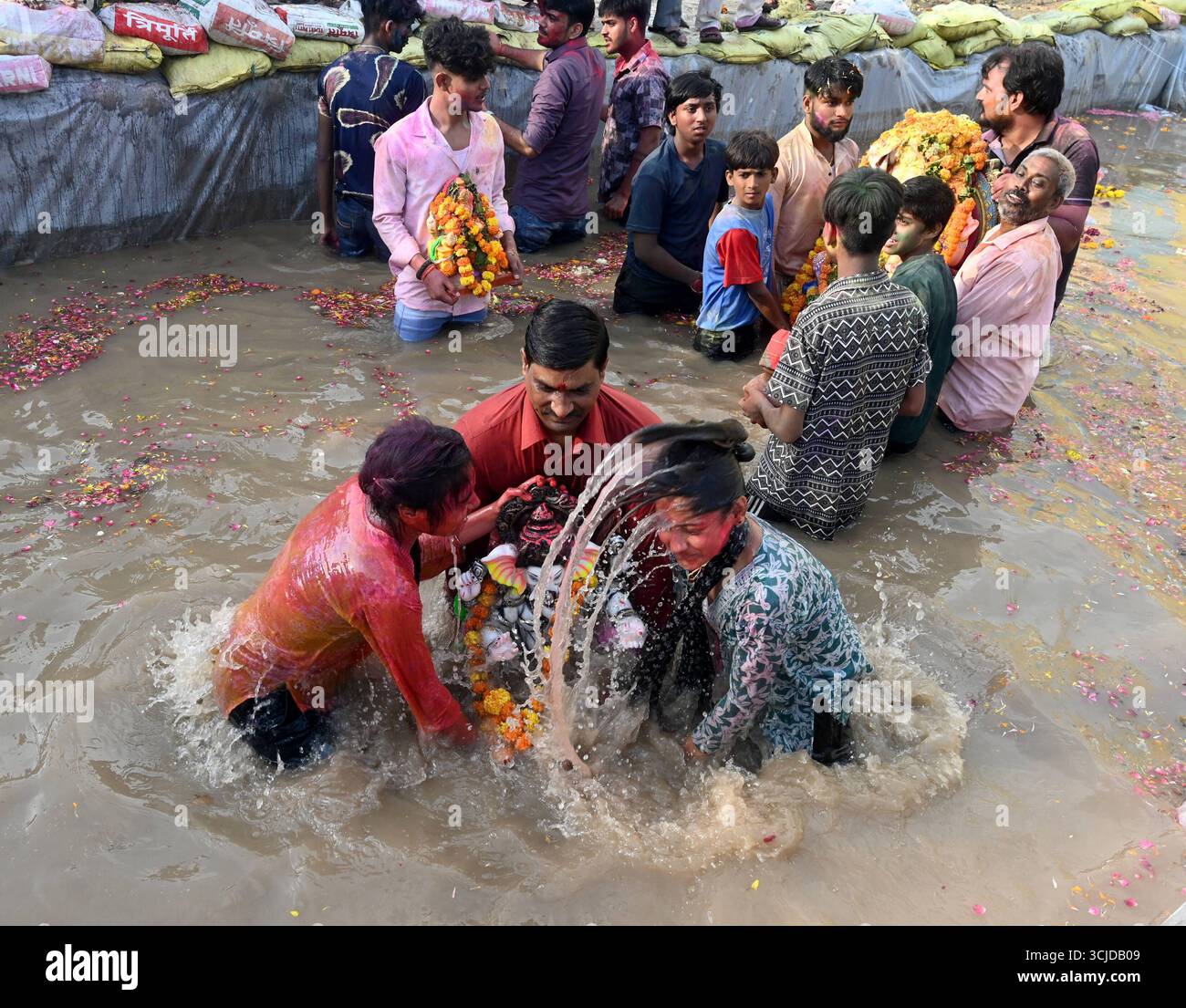 NEW DELHI, INDIA - SEPTEMBER 6: Devotees immersed the idol of Shree ...