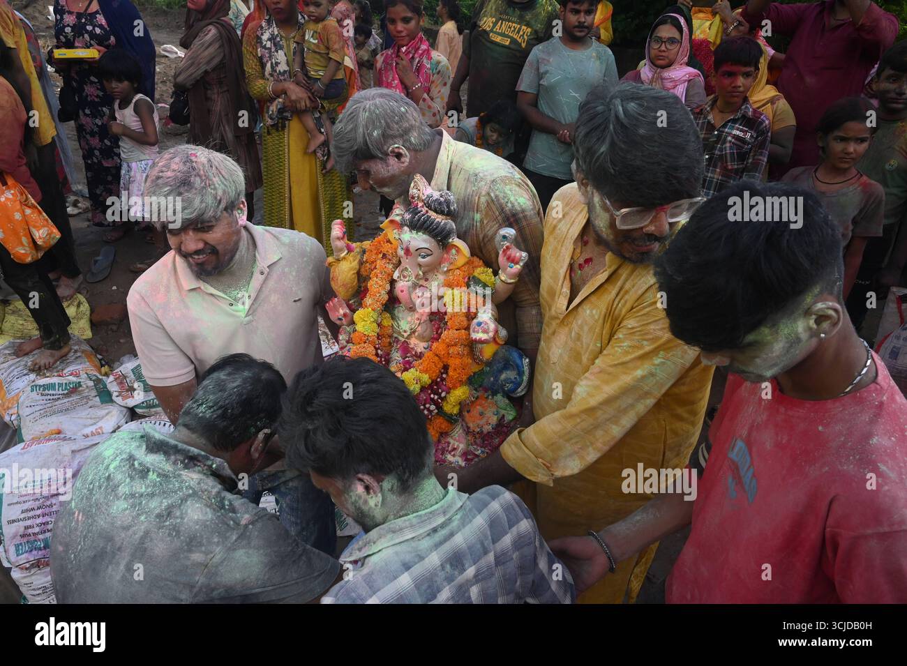 NEW DELHI, INDIA - SEPTEMBER 6: Devotees immersed the idol of Shree ...
