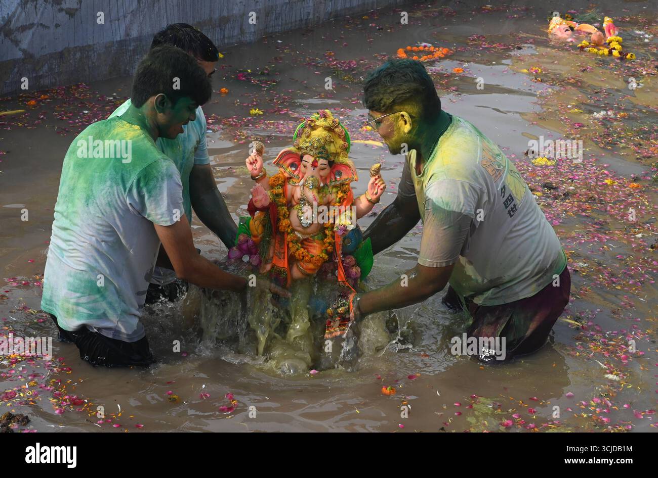 NEW DELHI, INDIA - SEPTEMBER 6: Devotees immersed the idol of Shree ...