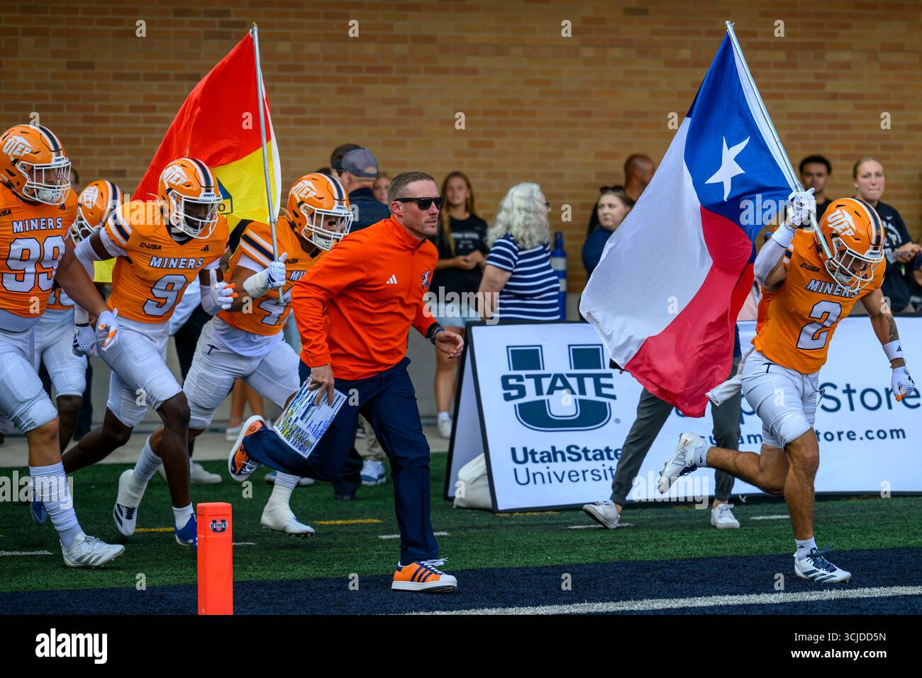 UTEP head coach Scotty Walden leads his team onto the field during an ...