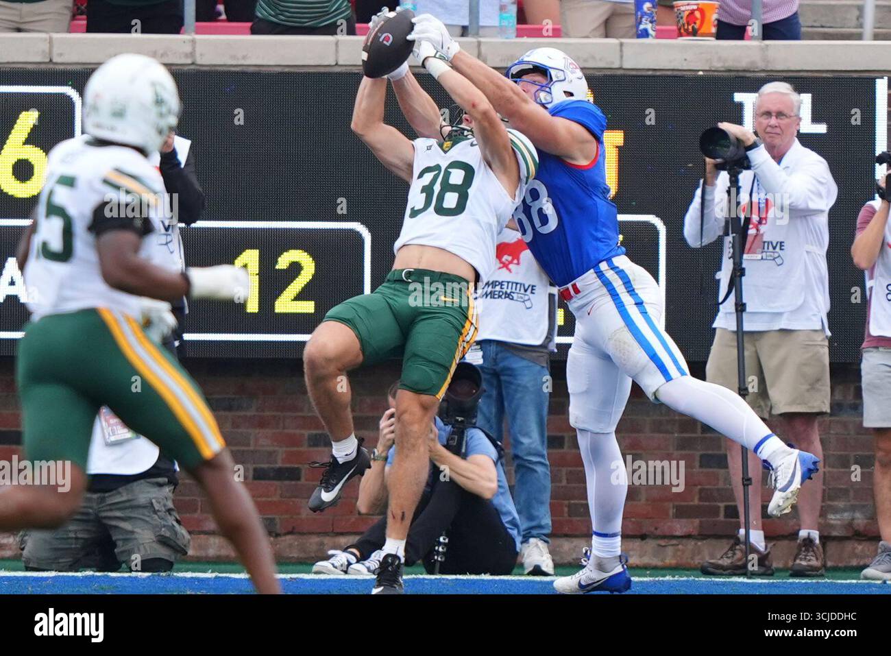 Baylor safety Jacob Redding (38) intercepts a pass in the end zone against SMU tight end Matthew ...