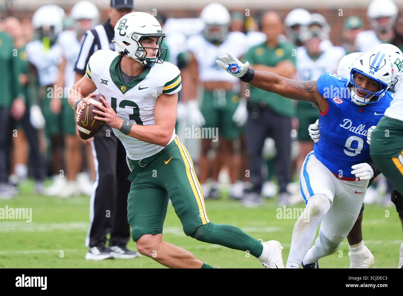 Baylor quarterback Sawyer Robertson (13) eludes SMU defensive end ...