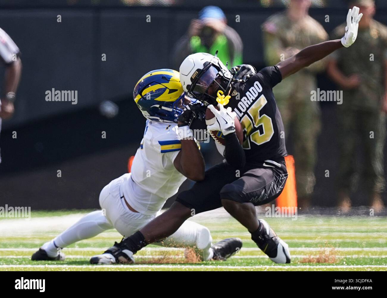 Delaware safety KT Seay, back, tackles Colorado wide receiver Quentin ...