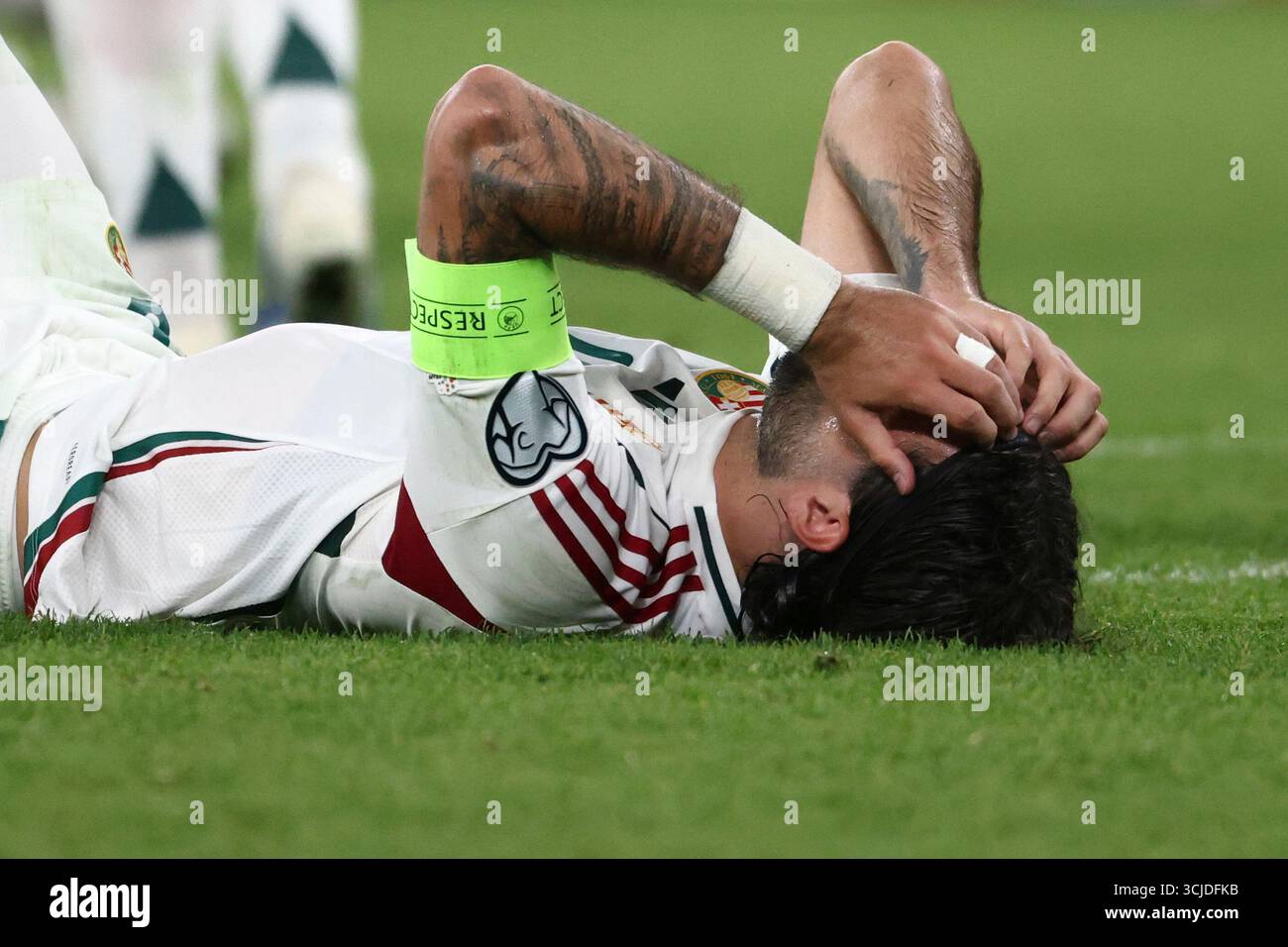 Hungary's Dominik Szoboszlai, on the ground, reacts at the end of a ...