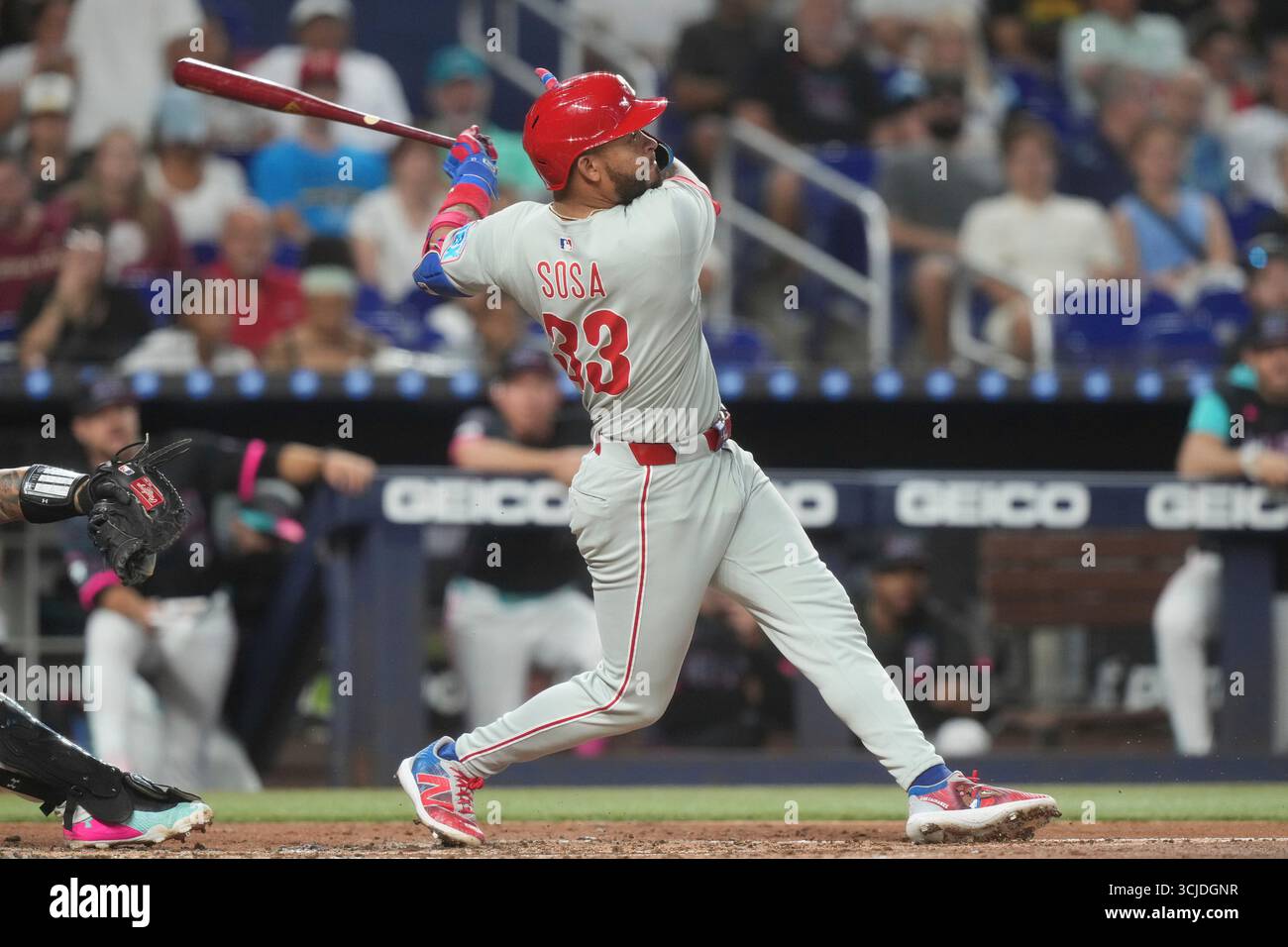 Philadelphia Phillies' Edmundo Sosa (33) hits a single during the second inning of a baseball ...