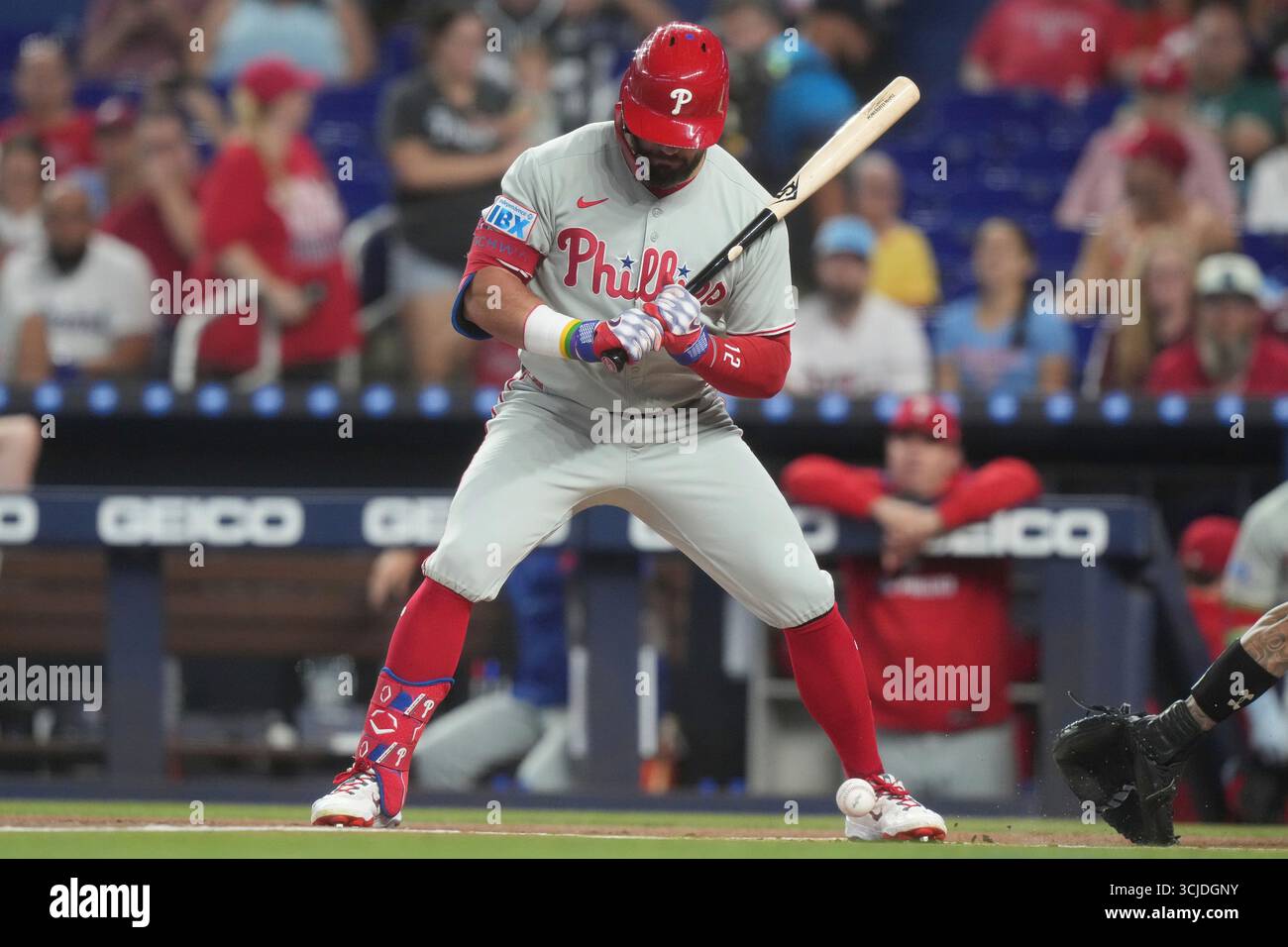 Philadelphia Phillies' Kyle Schwarber (12) is hit by a pitch during the ...