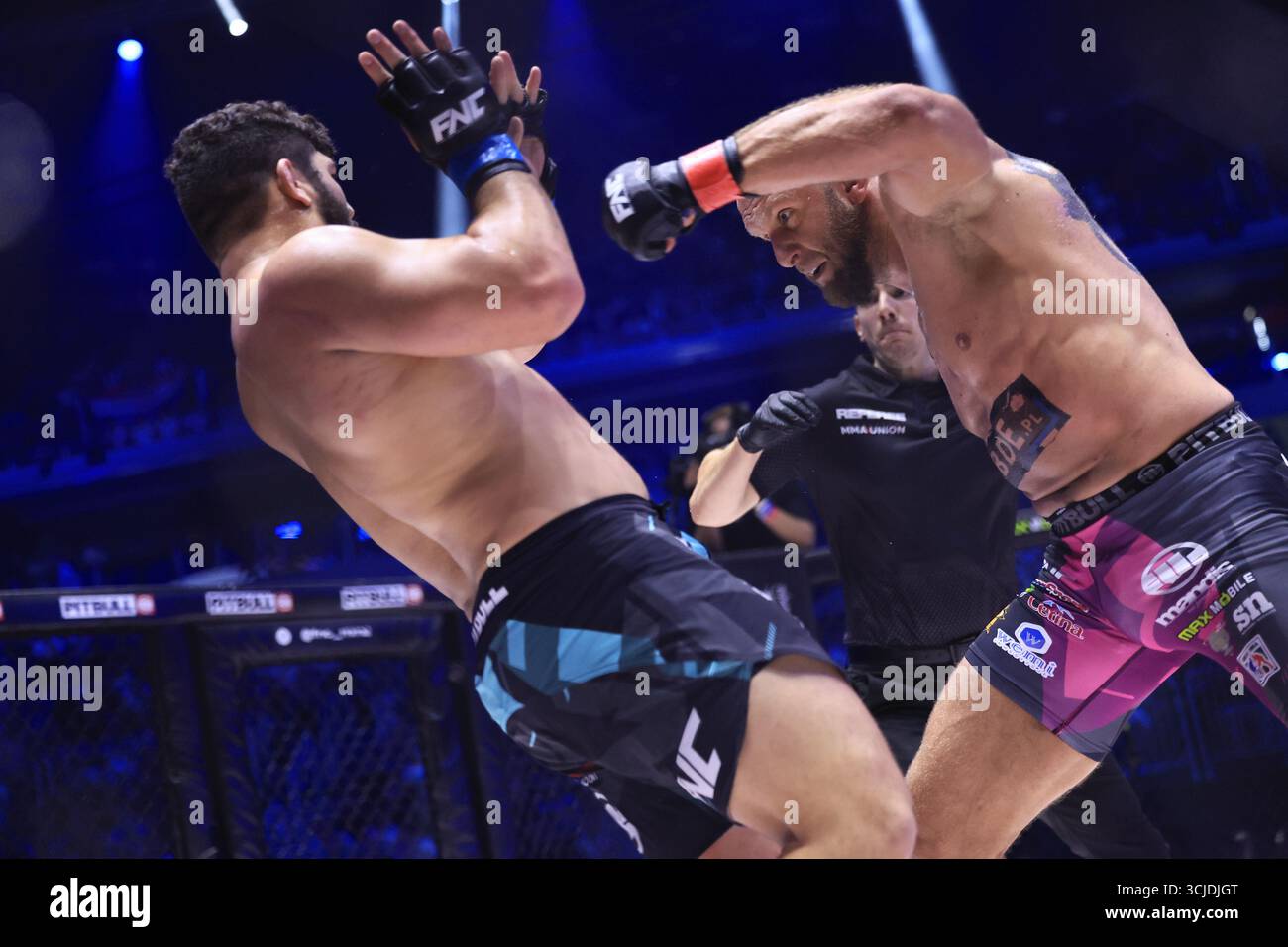 Michal Andryszak of Poland punches Said Sowma of United States in ...