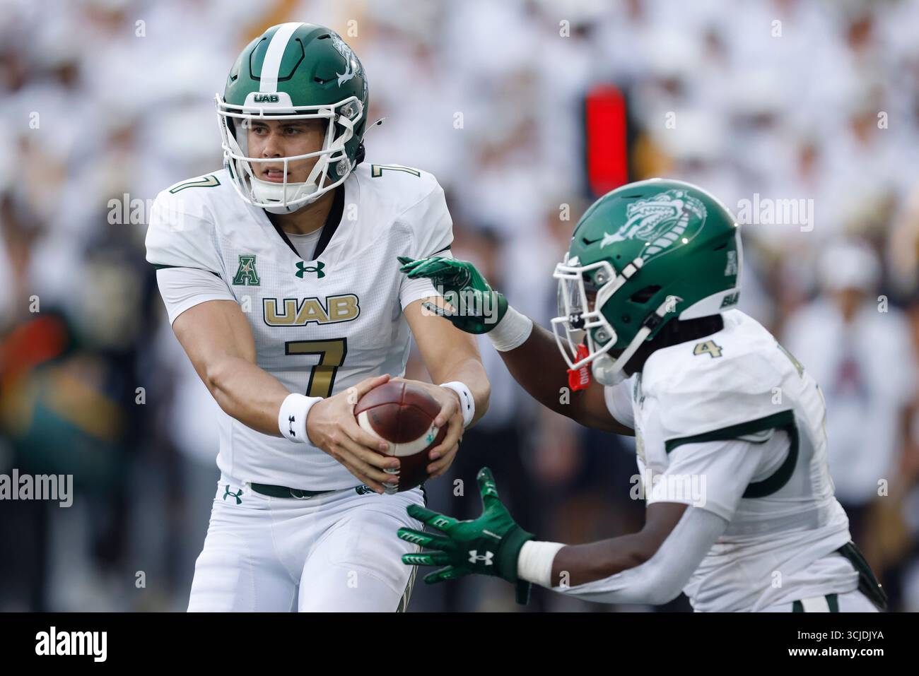 UAB quarterback Jalen Kitna (7) hands off to running back Jevon Jackson ...