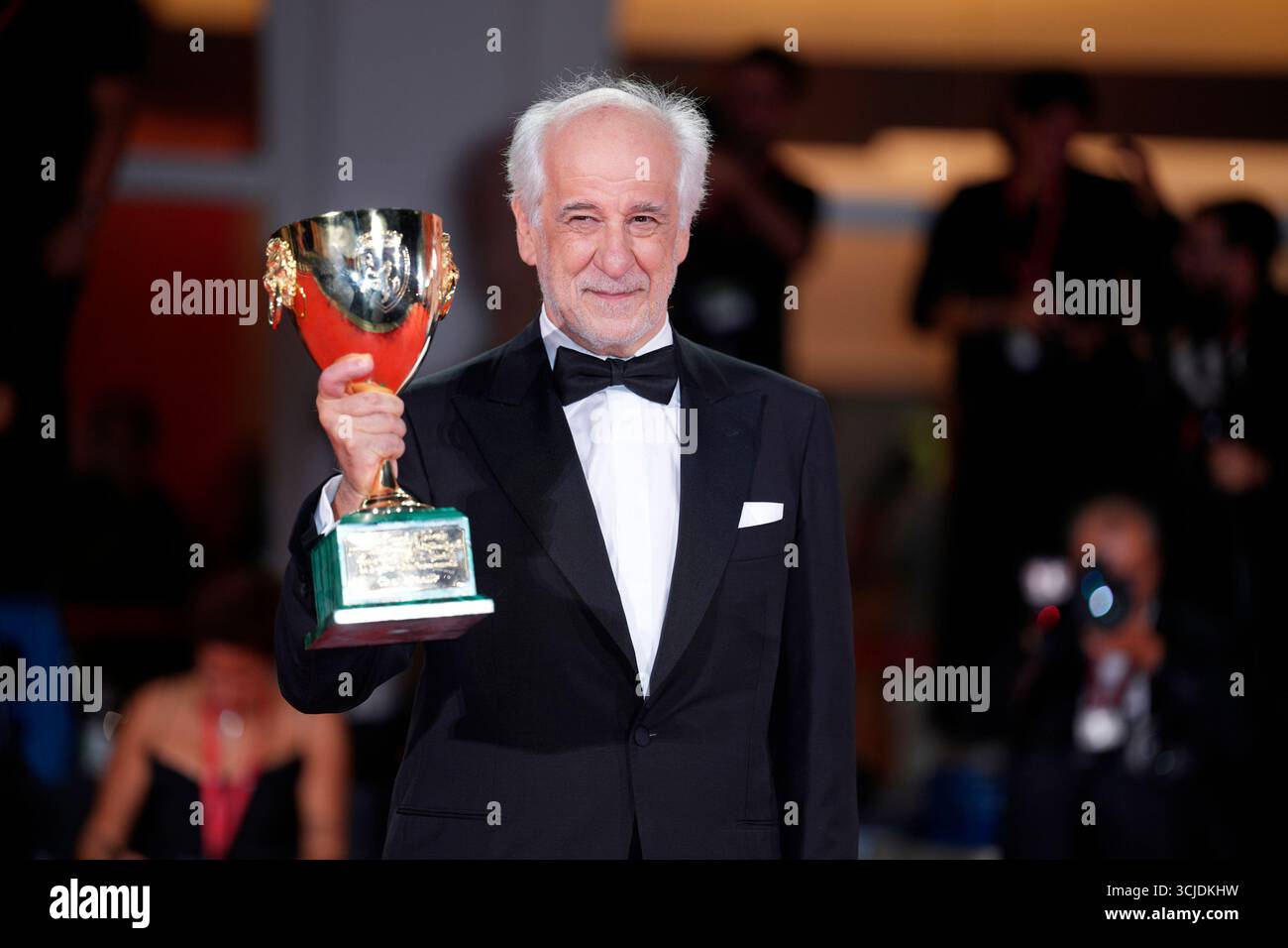 Toni Servillo poses with the Coppa Volpi for Best Actor for 'La Grazia ...