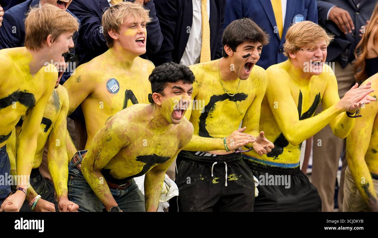 Georgia Tech fans cheer during the first half of an NCAA college ...