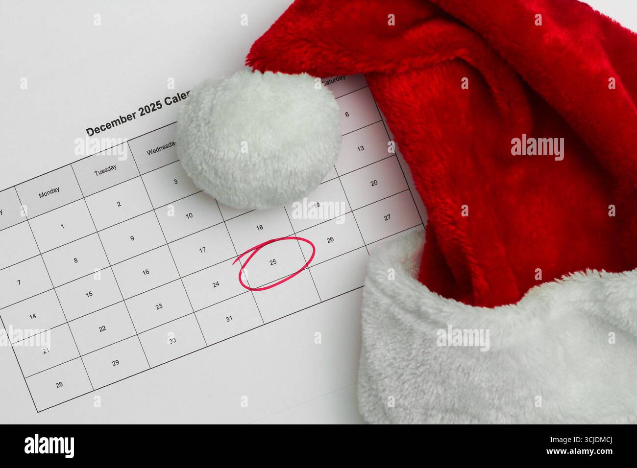 Santa Hat on Calendar with December 25th Circled Stock Photo - Alamy