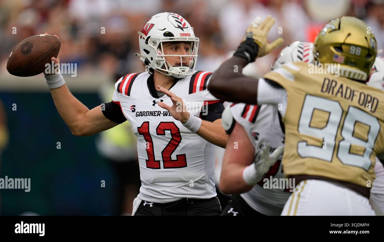 Gardner-Webb quarterback Cole Pennington (12) passes under pressure ...