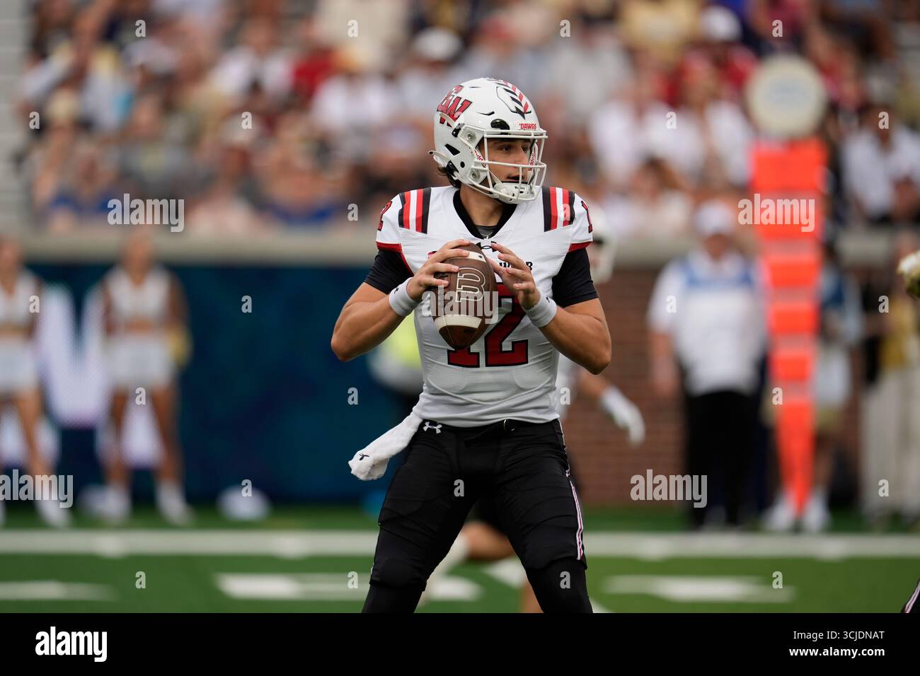 Gardner-Webb quarterback Cole Pennington (12) works against the Georgia ...