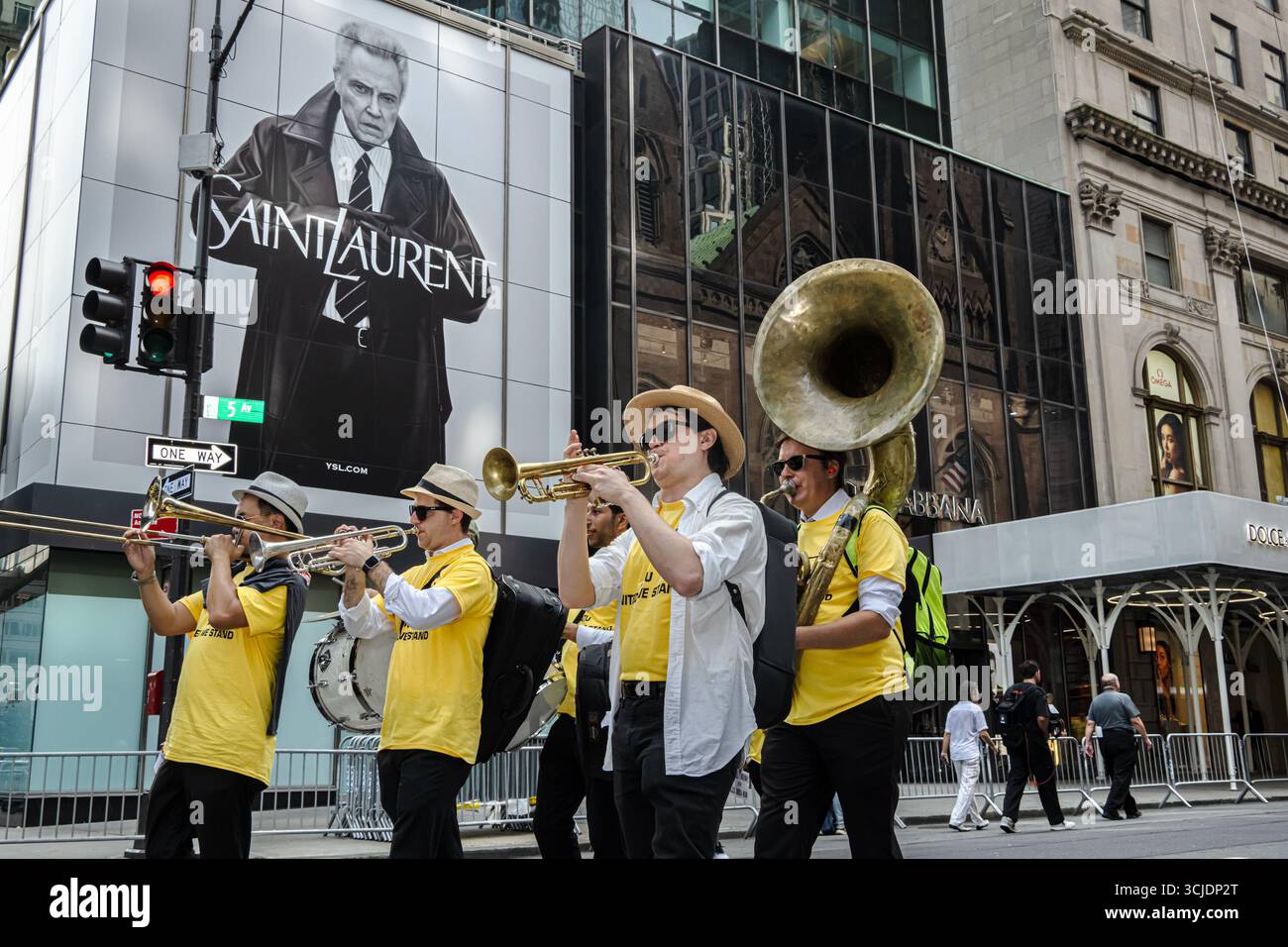 The A.F.L.-C.I.O. Local 1181-1061 band march past an Yves Saint Laurent ...