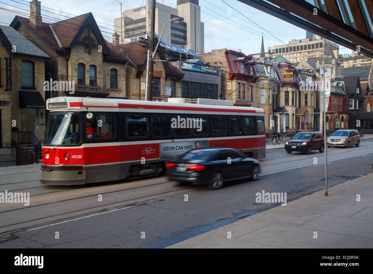 The Beautiful historical buildings in a typical street and a tram in ...
