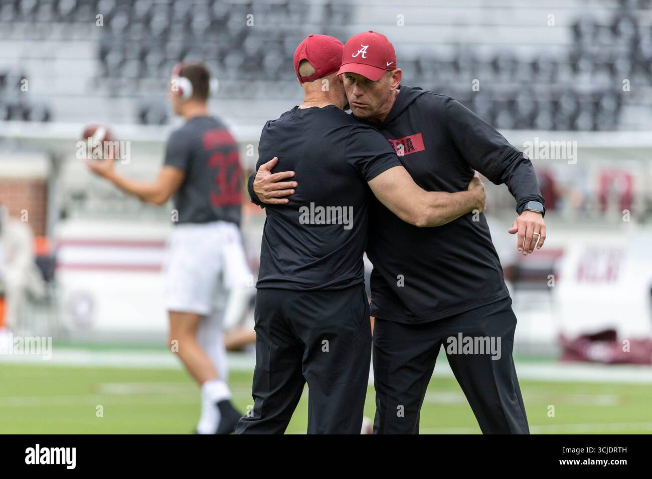 Alabama head coach Kalen DeBoer, right, hugs Alabama offensive coordinator Ryan Grubb before an ...