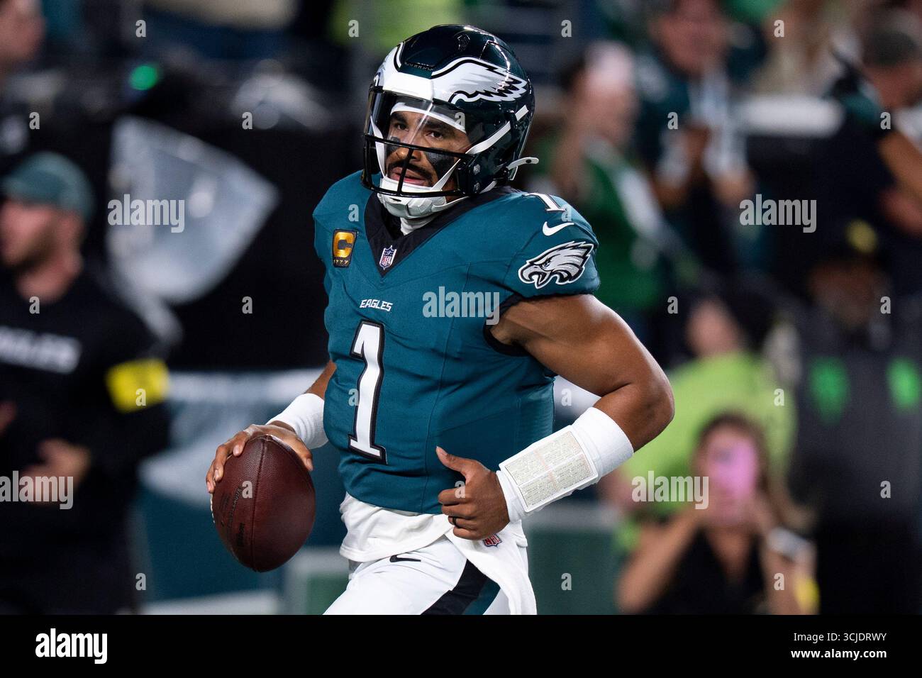 Philadelphia Eagles quarterback Jalen Hurts looks on after scoring a ...