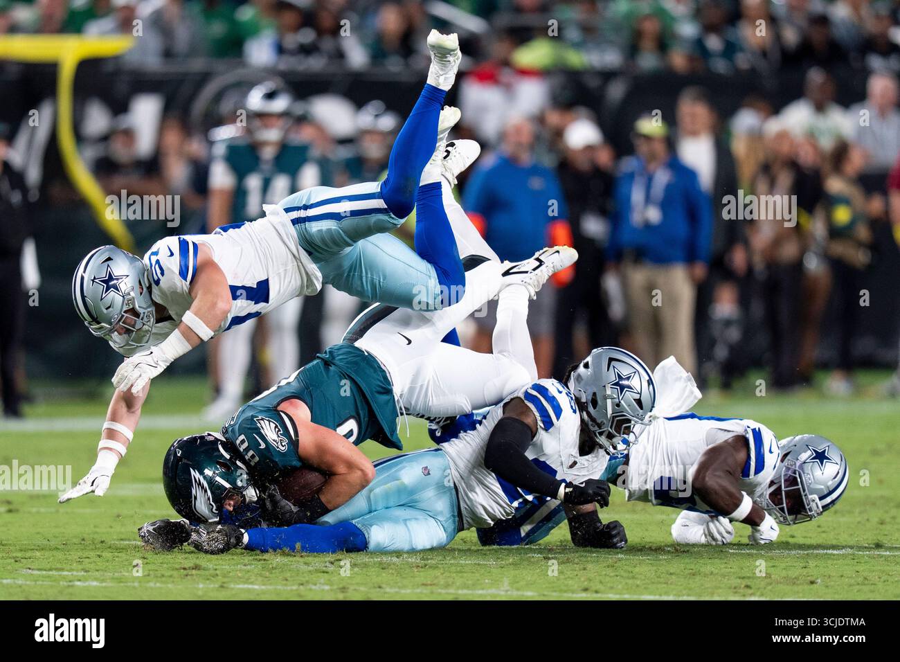 Philadelphia Eagles tight end Dallas Goedert, center left, gets taken down by the Dallas Cowboys ...