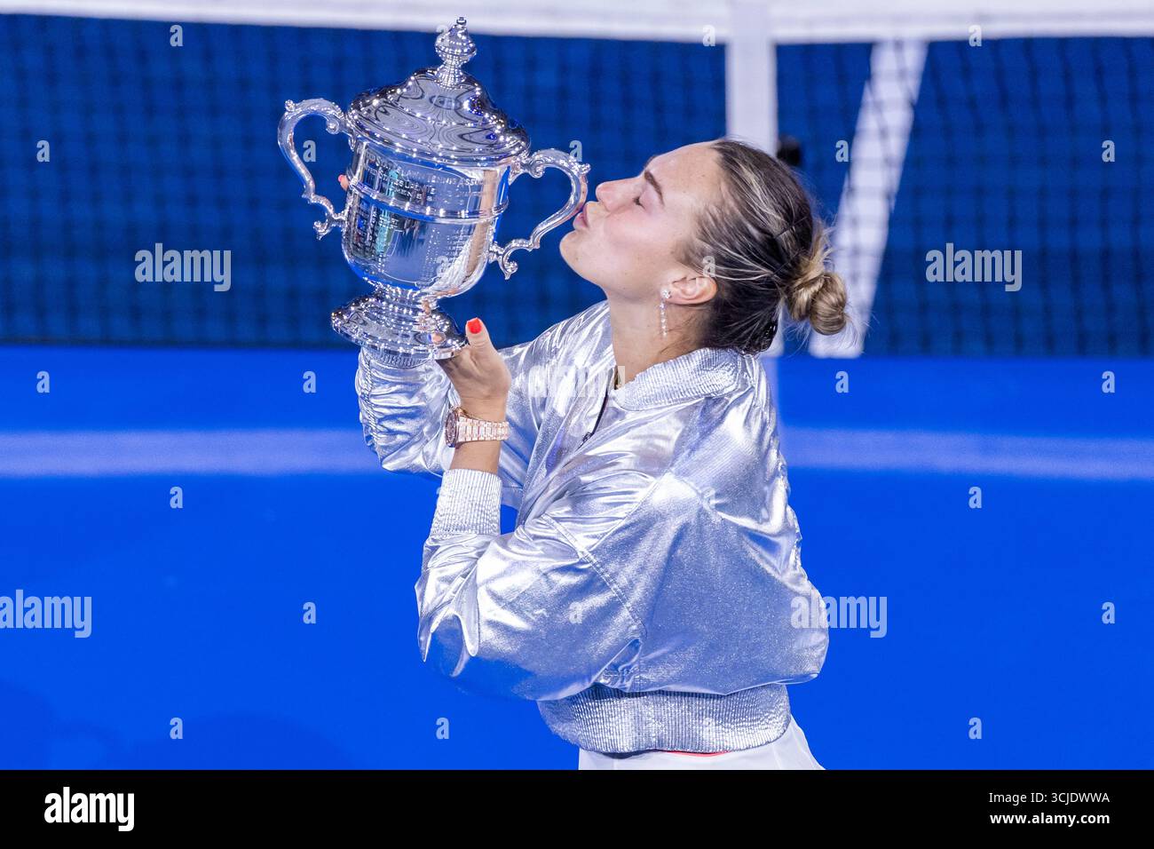 Aryna Sabalenka of Belarus celebrates with her trophy after her win in ...