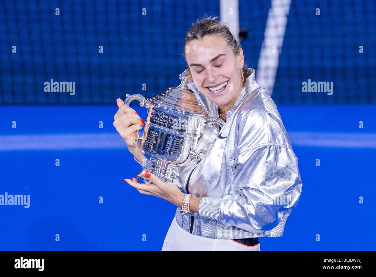 Aryna Sabalenka of Belarus celebrates with her trophy after her win in ...