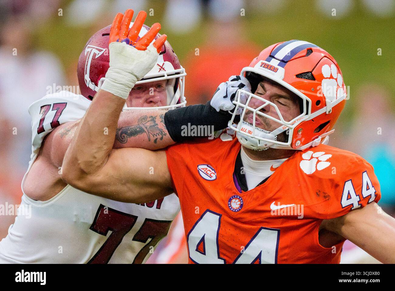 Troy offensive lineman Garner Langlo (77) blocks Clemson defensive end ...