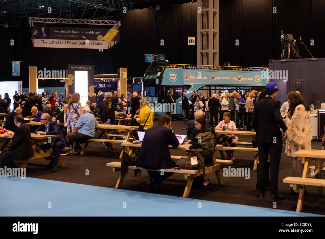 Birmingham, UK. 05 SEP, 2025. Reform battle bus next to people queuing ...