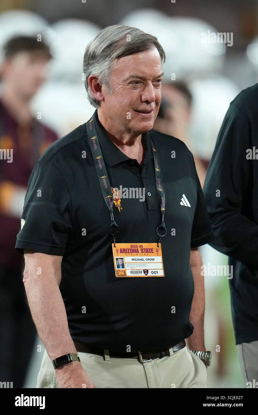 Arizona State Unviersity president Michael Crow walks near the field ...