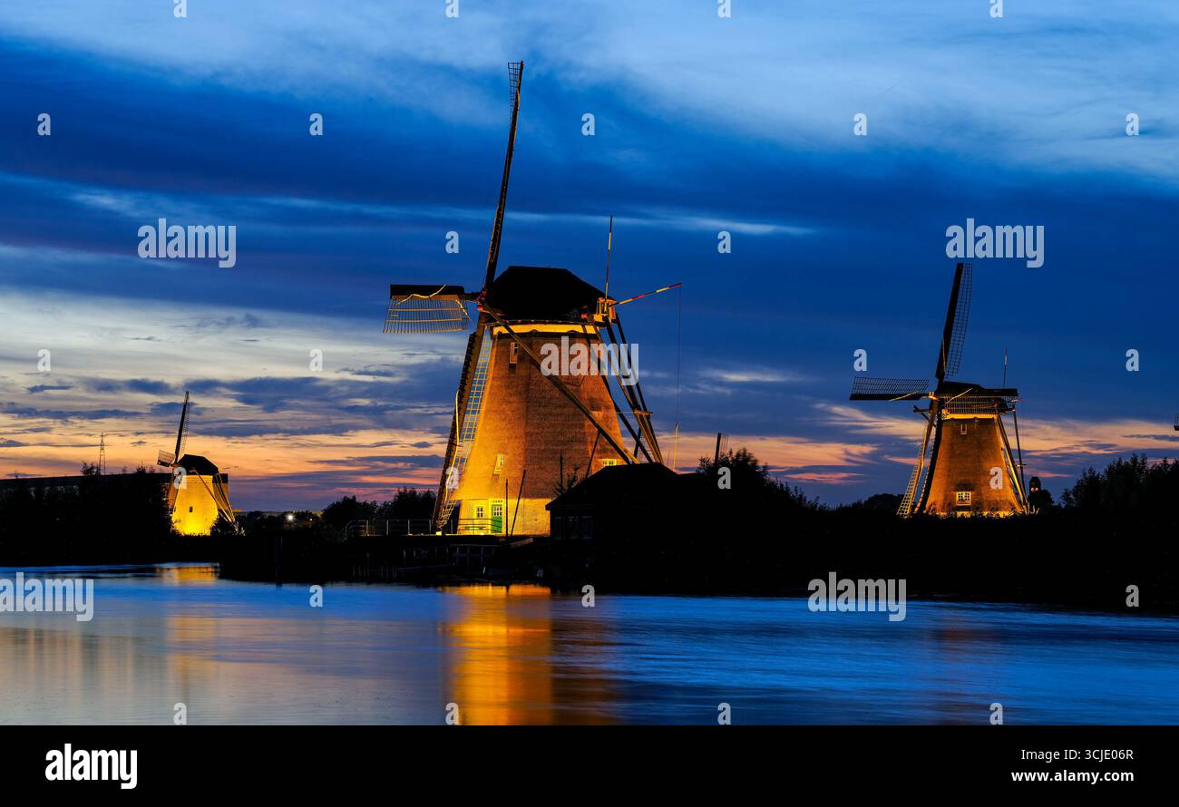 At dusk, the small Dutch Village of Kinderdijk holds "Illumination Week" activities in ...