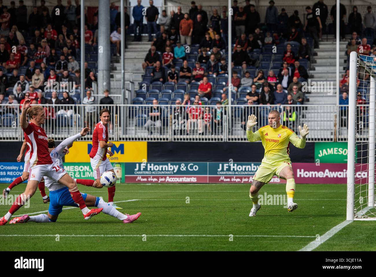 Connor Ripley of Swindon Town prepares to block an effort on goal ...