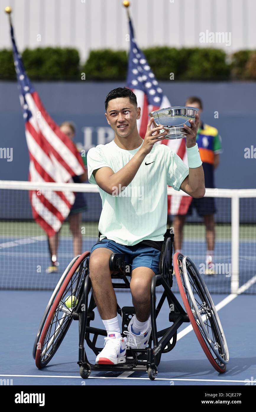 Tokito Oda of Japan poses with the victor's trophy after winning the ...