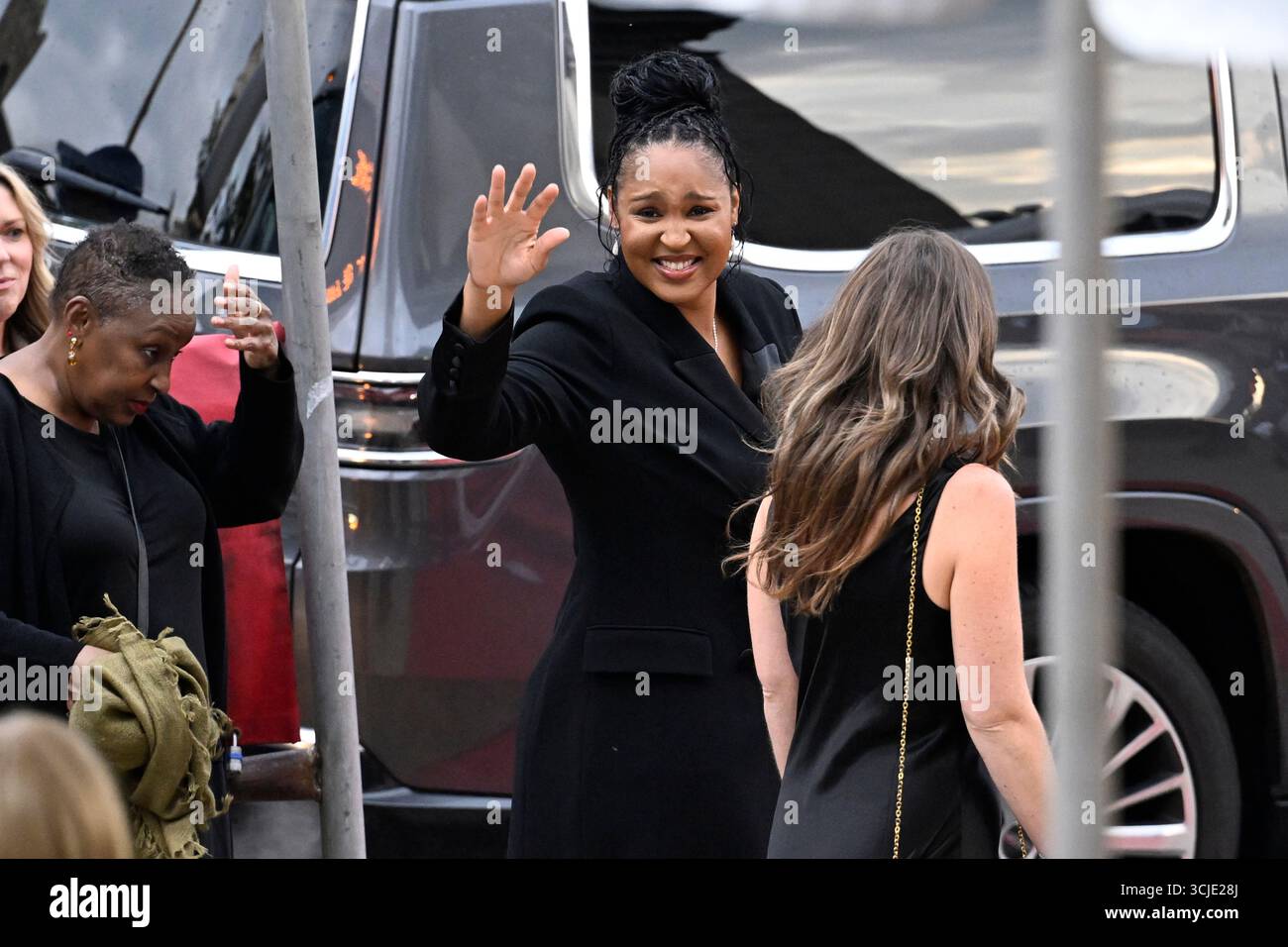 Maya Moore, center, waves as she arrives for her enshrinement in the ...