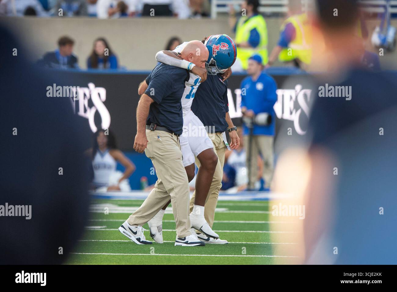 Mississippi quarterback Austin Simmons (13) is walked off the field after an injury during the ...
