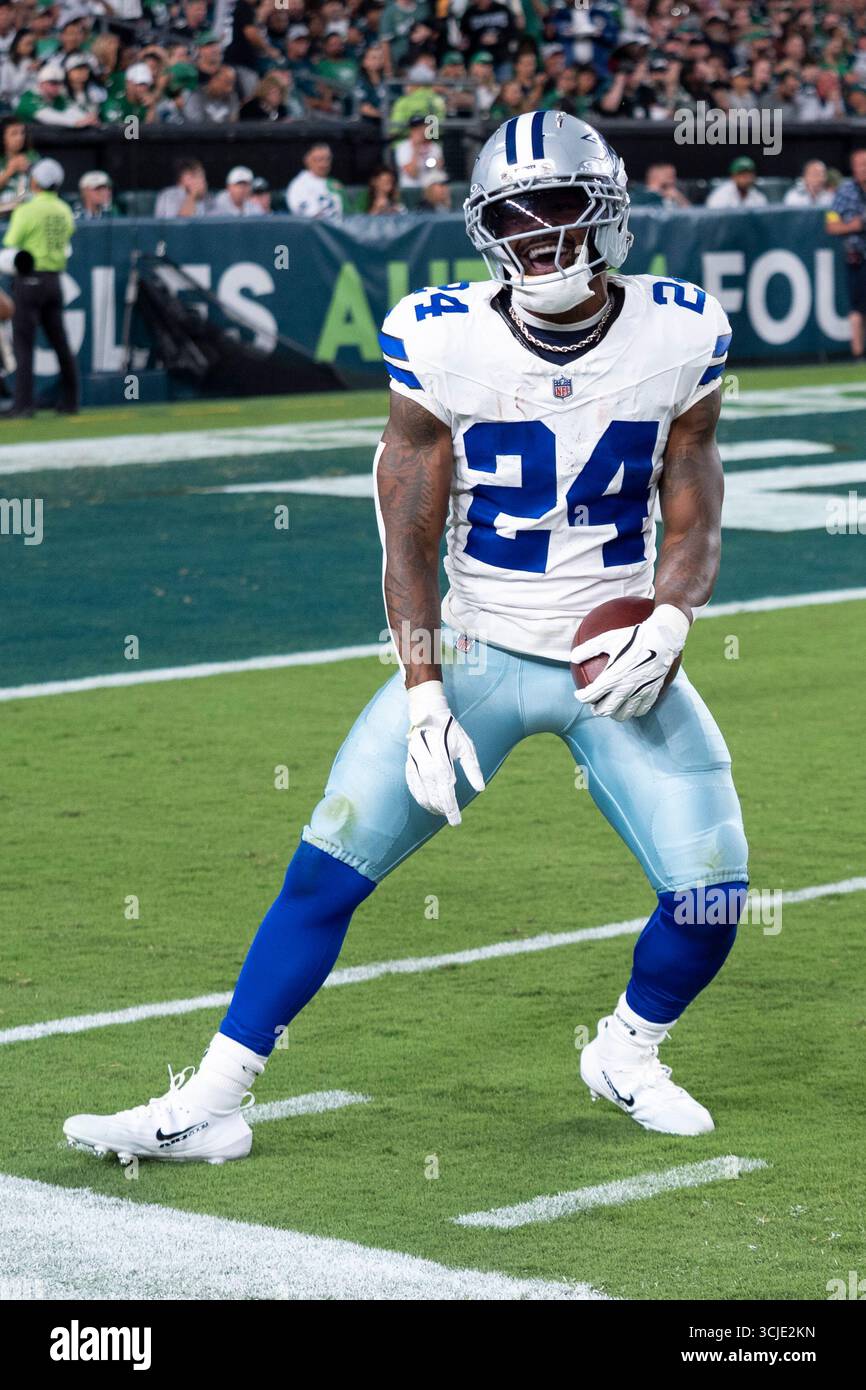 Dallas Cowboys running back Miles Sanders reacts to his run during an ...
