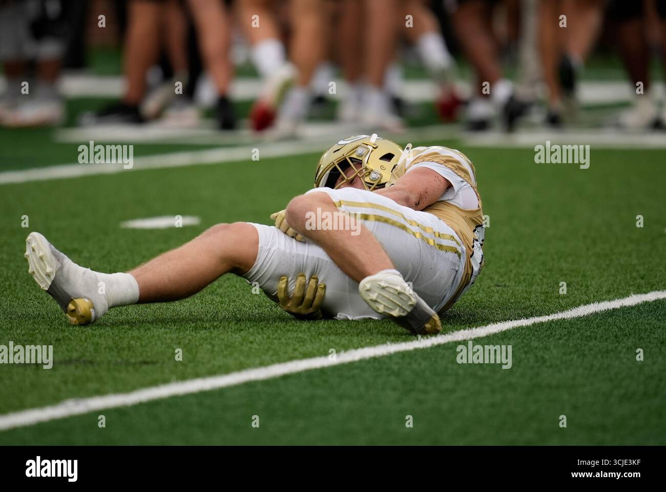 Georgia Tech wide receiver Chris Elko (89) lies injured against the ...