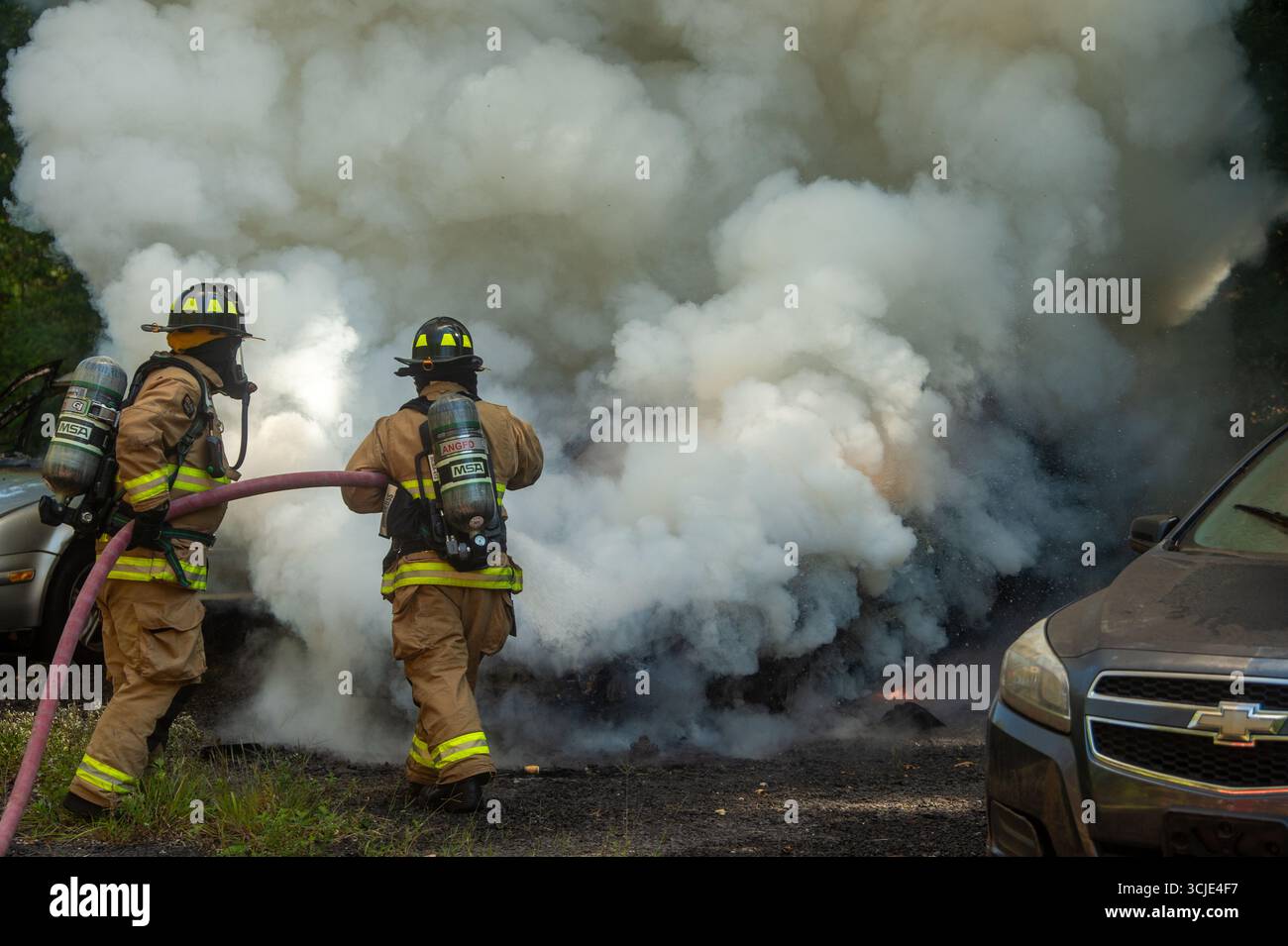 Firefighters battle car fire hi-res stock photography and images - Alamy