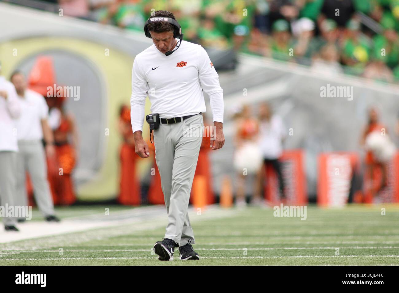 Oklahoma State head coach Mike Gundy walks on the field during the ...
