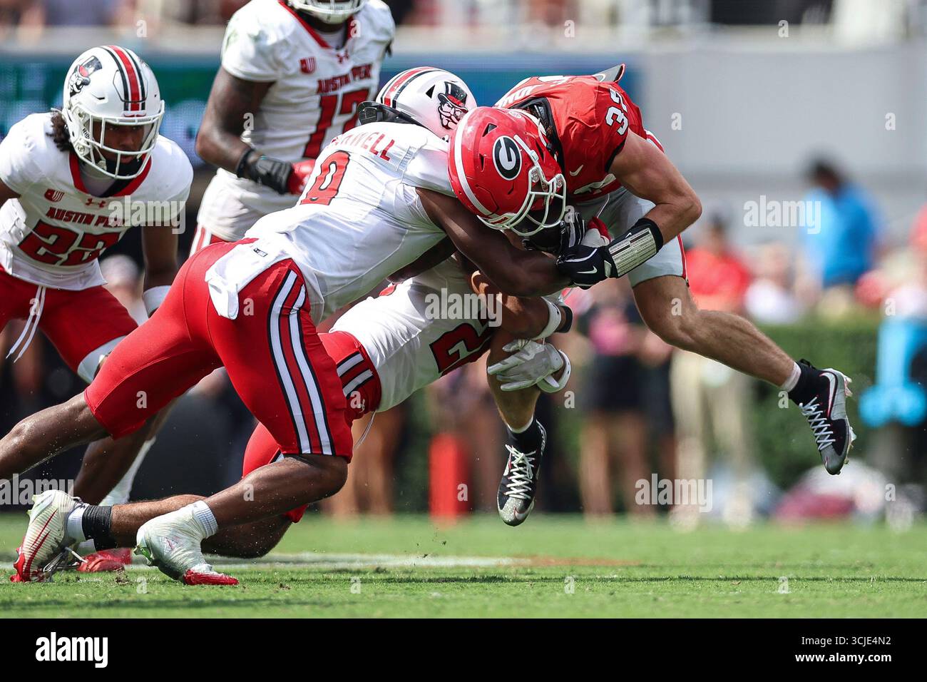 Austin Peay linebacker Davion Blackwell (9) tackles Georgia running ...