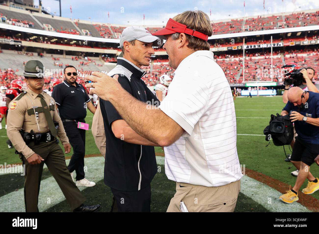 Austin Peay head coach Jeff Faris, left, and Georgia head coach Kirby ...