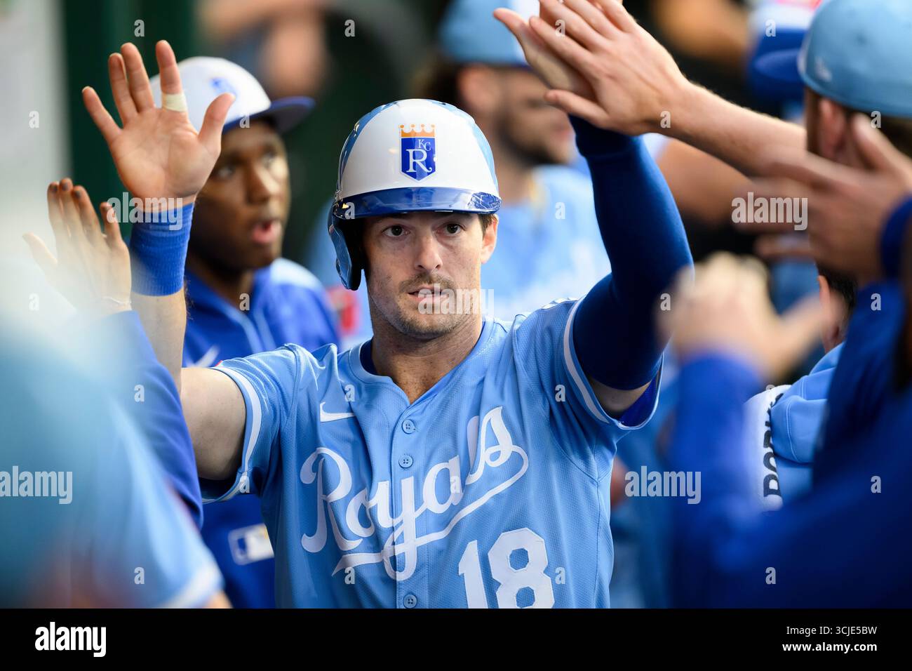 Kansas City Royals' Mike Yastrzemski is congratulated after scoring ...