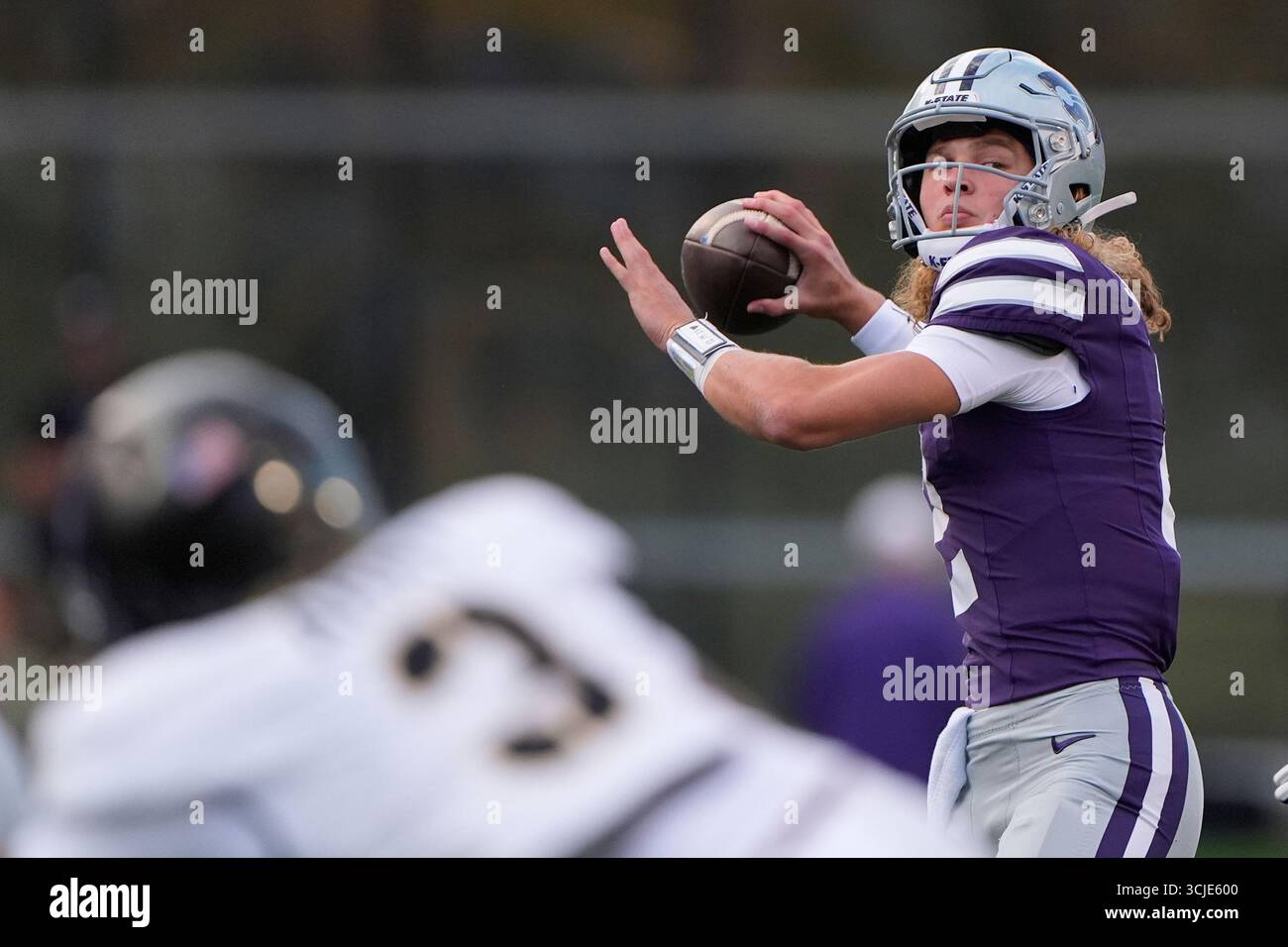 Kansas State quarterback Avery Johnson looks to pass during the first ...
