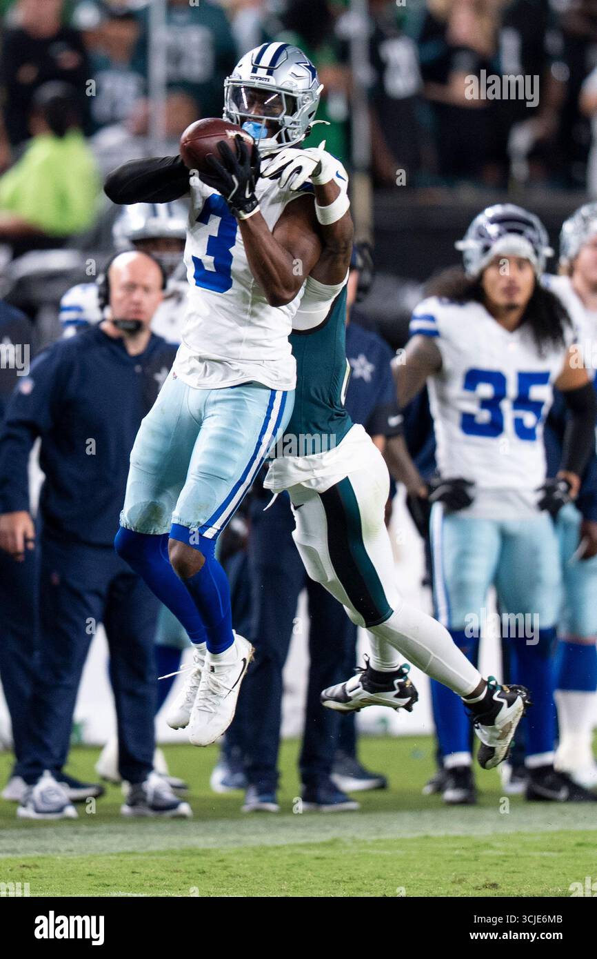 Dallas Cowboys wide receiver George Pickens, left, leaps for the catch ...