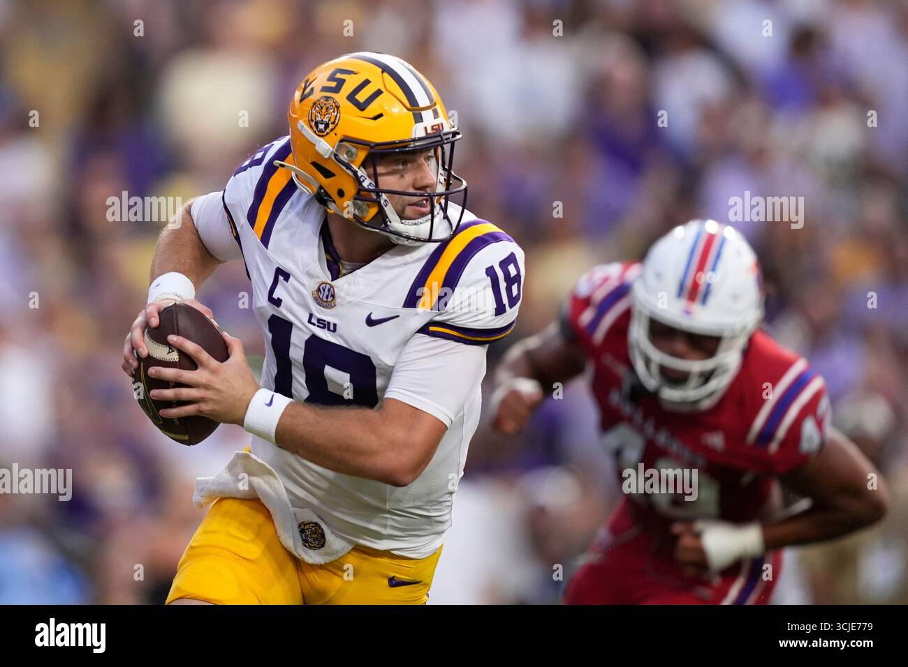 LSU quarterback Garrett Nussmeier (18) scrambles in the first half of ...