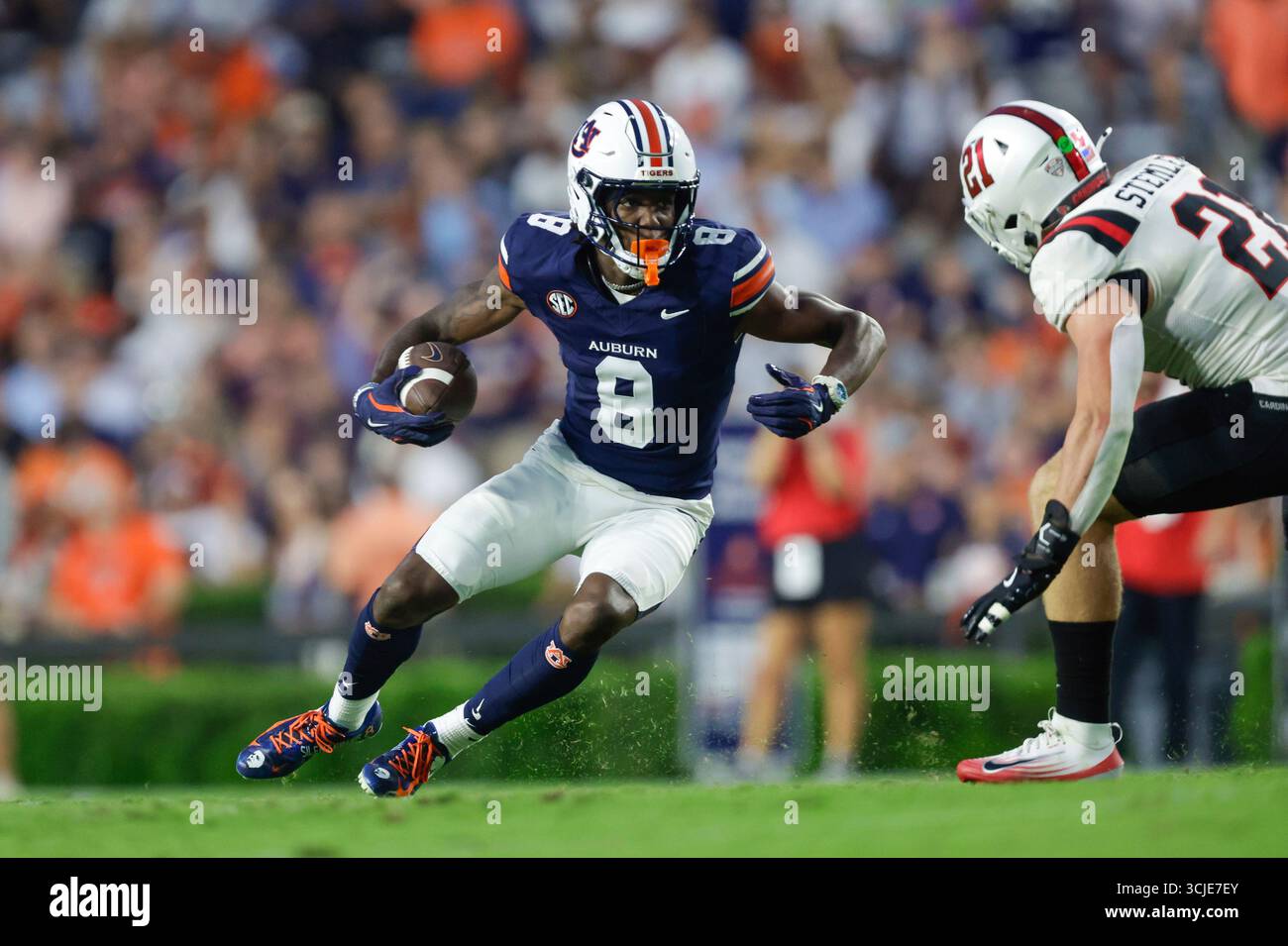 Auburn wide receiver Cam Coleman (8) runs with the ball as Ball State ...
