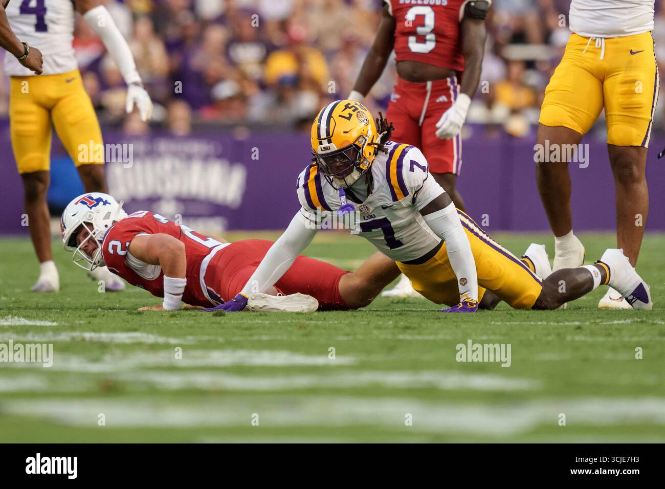 LSU linebacker Harold Perkins Jr. (7) helps knock down Louisiana Tech ...