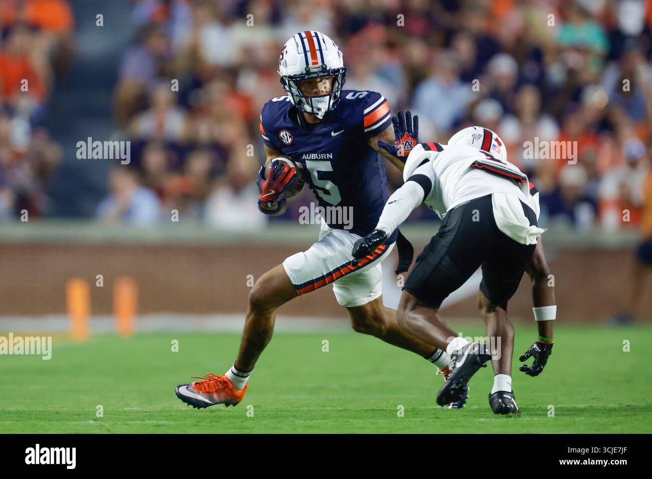 Auburn wide receiver Horatio Fields (5) runs with the ball as Ball ...
