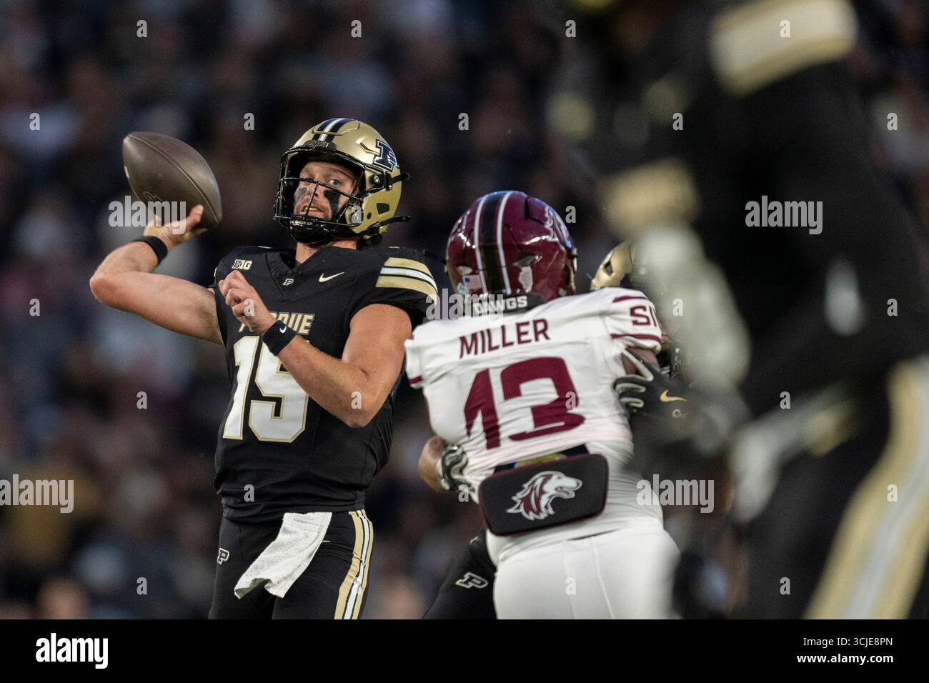 Purdue quarterback Ryan Browne (15) looks to the end zone for a ...