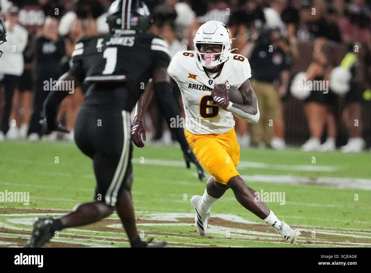 Arizona State running back Kanye Udoh (6) attempts to evade Mississippi ...