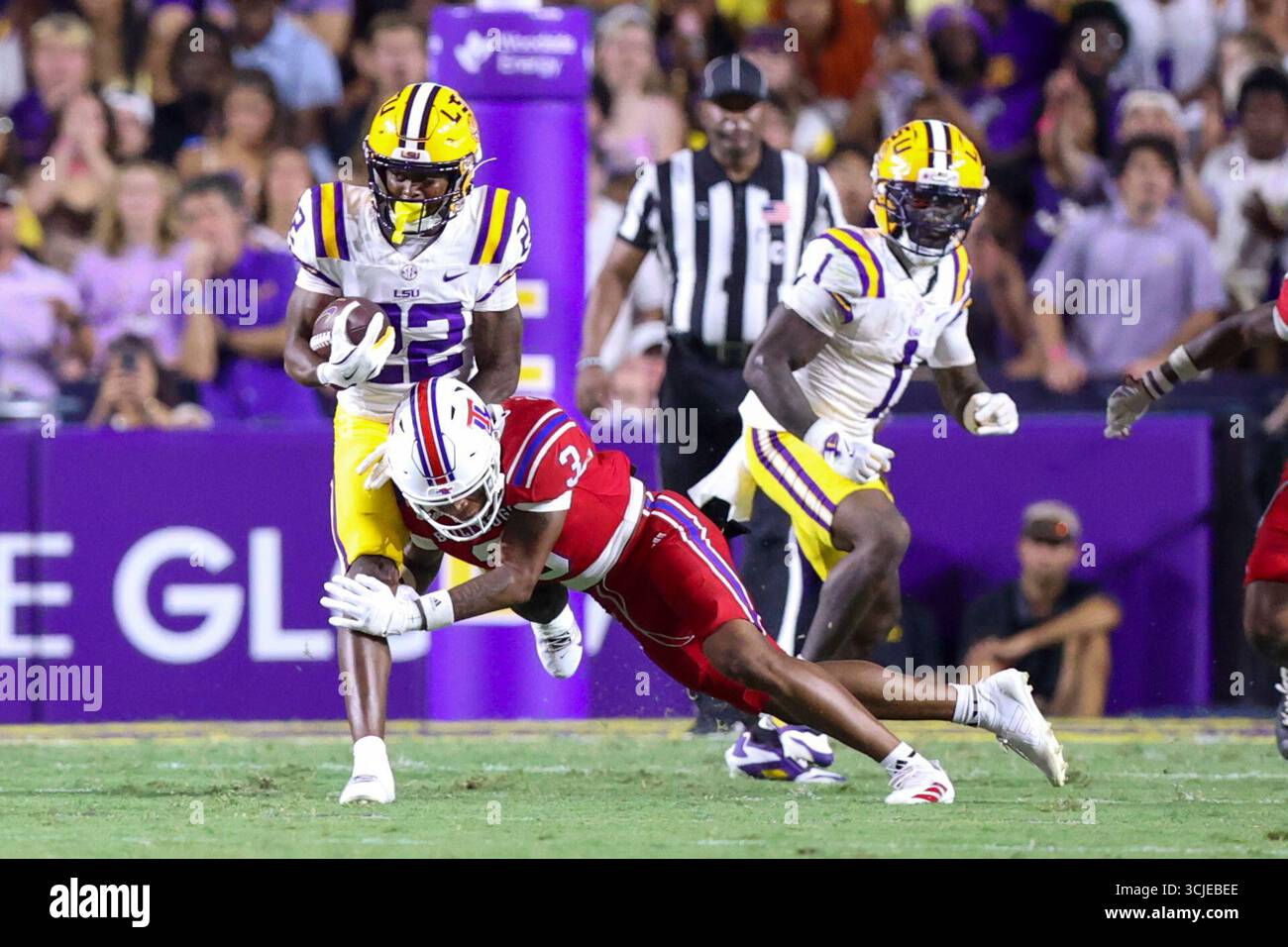 LSU Tigers running back Harlem Berry (22) tries to run through the ...