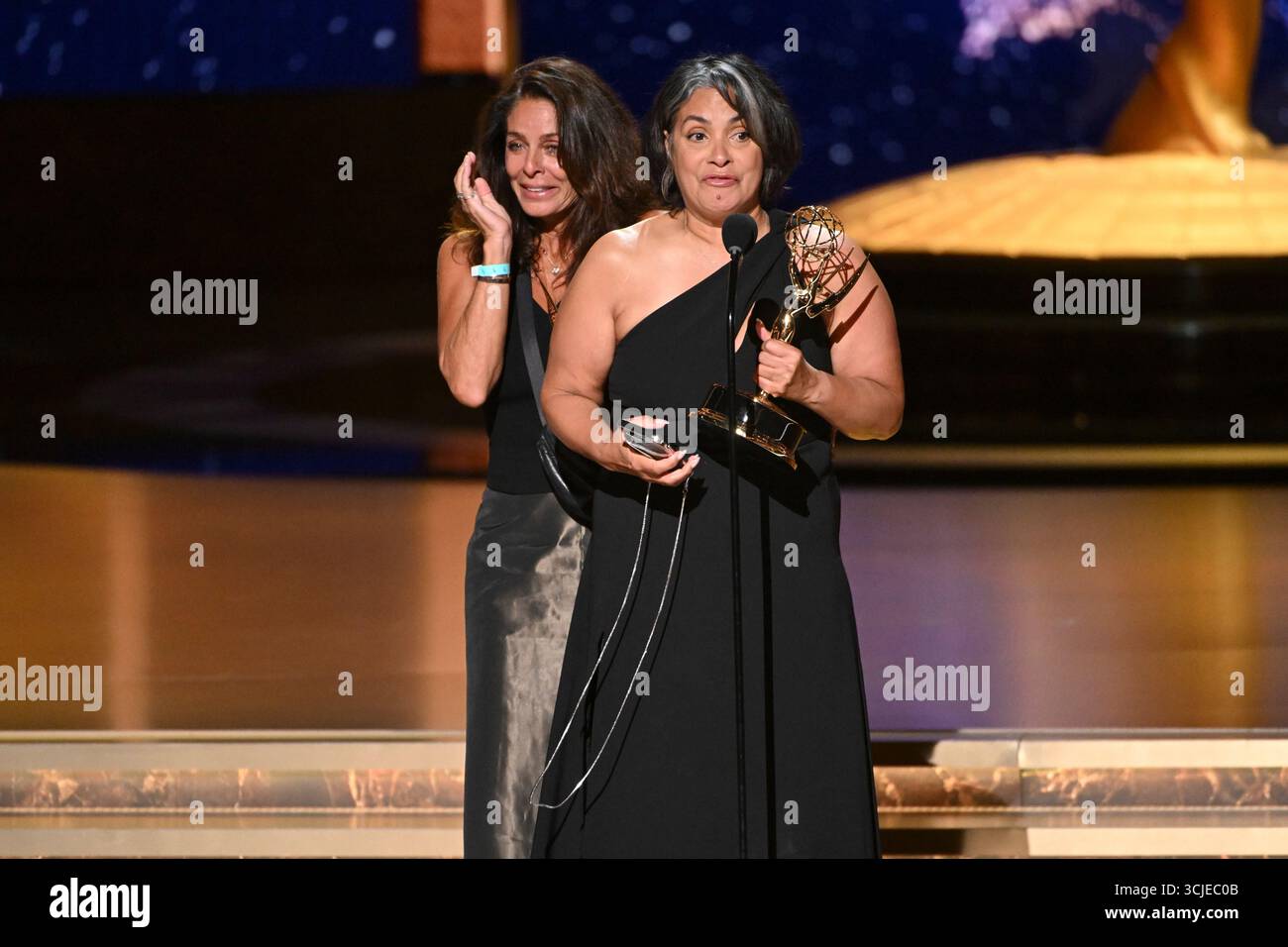 EXCLUSIVE - Kim Collea, from left, and Martha Melendez accept the ...