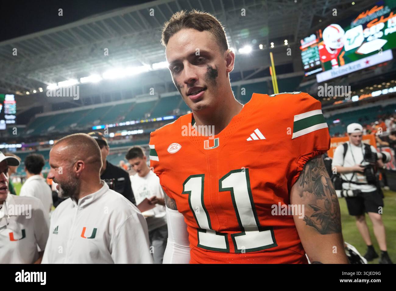 Miami quarterback Carson Beck (11) walks off the field after defeating Bethune-Cookman in an ...